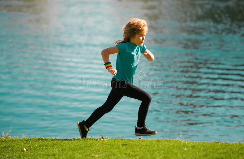 Child Boy Running Outdoors. Child Runner Jogger Running in the Nature ...