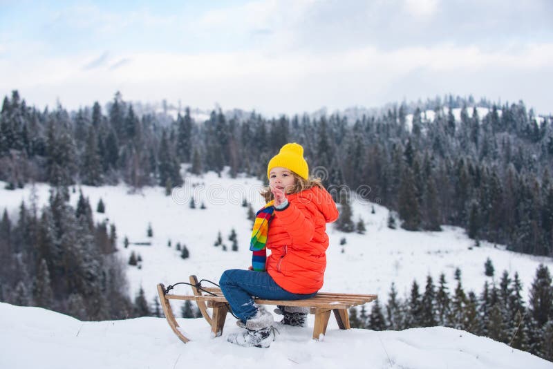 Child Boy Sledding in Winter. Kid Riding on Snow Slides in Winter ...