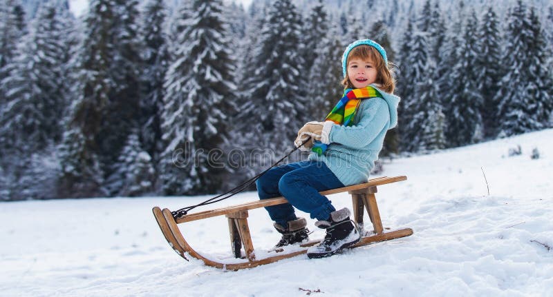 Child Boy Sledding on Winter Snowy Winter Park. Stock Photo - Image of ...