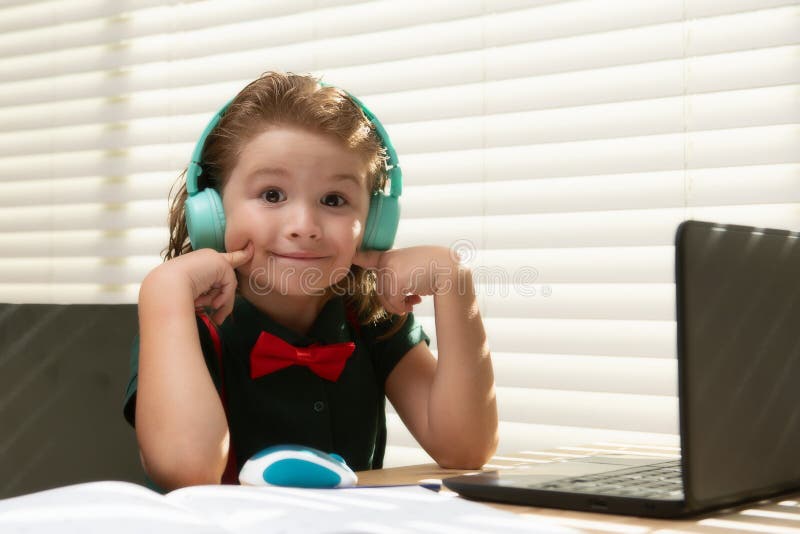 Child Boy Using a Laptop and Study Online Lesson. Pupil at School. Cute ...