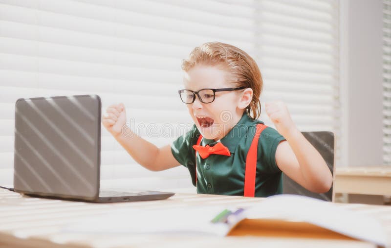 Child Boy Using a Laptop and Study Online Lesson. Pupil at School. Cute ...