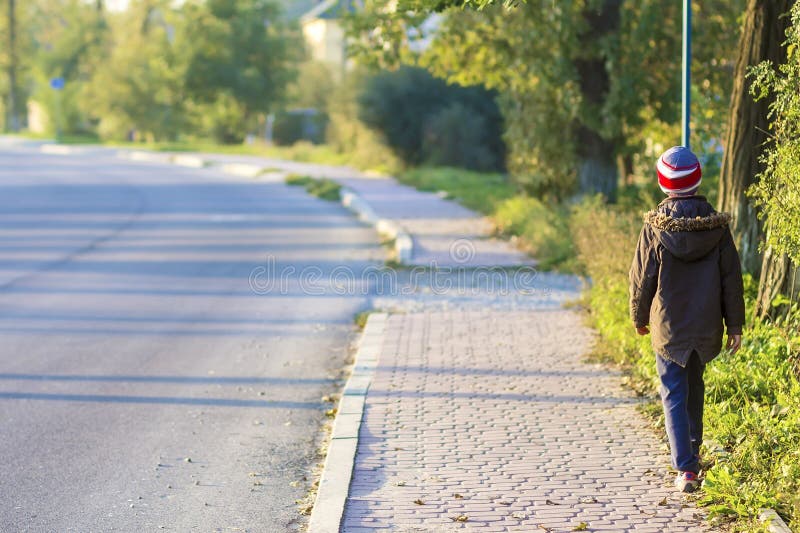 Child Boy Walking Alone on a Sidewalk Stock Photo - Image of lifestyle ...