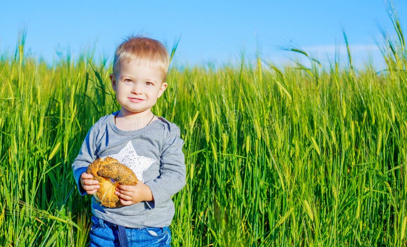 Child with bread stock image. Image of outsides, emotion - 99002493