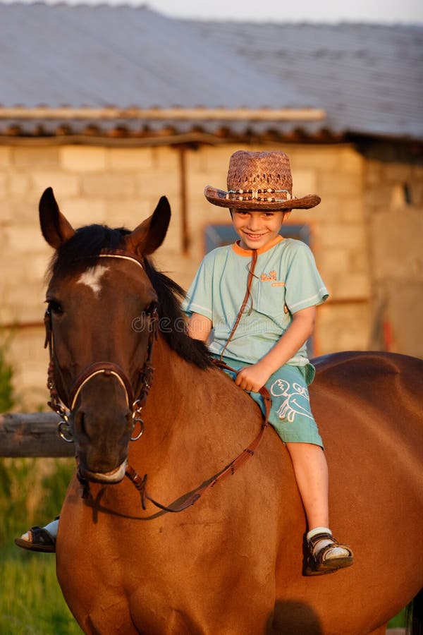 Child on brown horse stock image. Image of portrait, human - 15077915