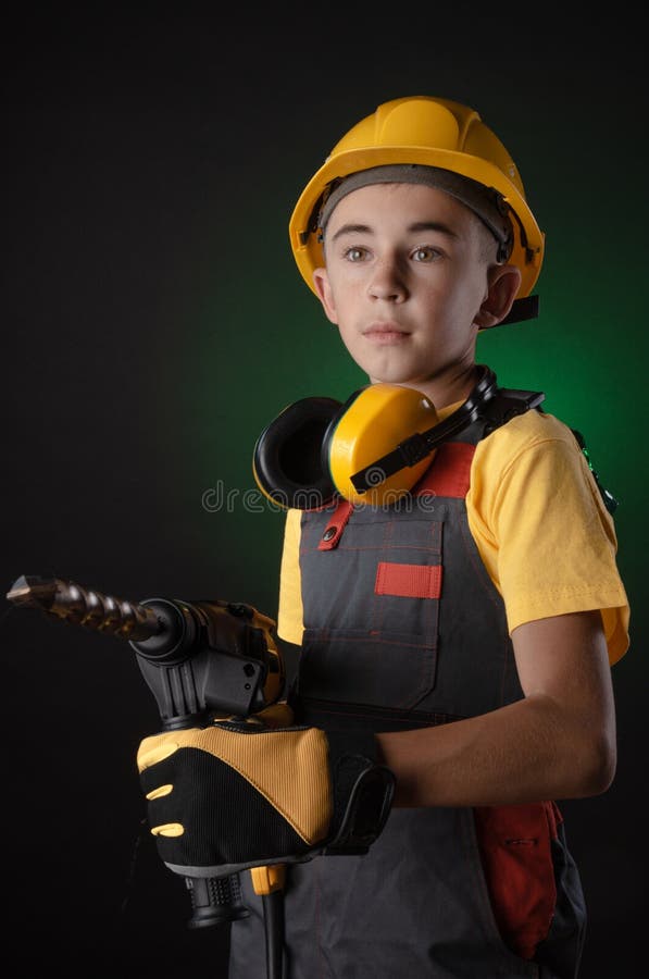 Child the Builder Costume Posing with a Work Tool Stock Photo - Image ...