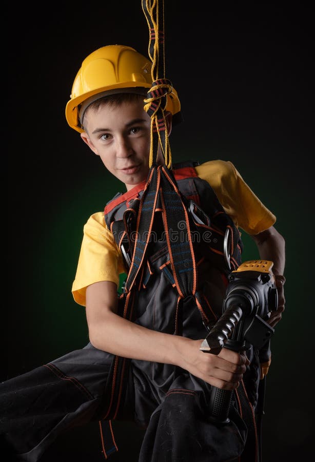 Child the Builder Costume Posing with a Work Tool Stock Photo - Image ...
