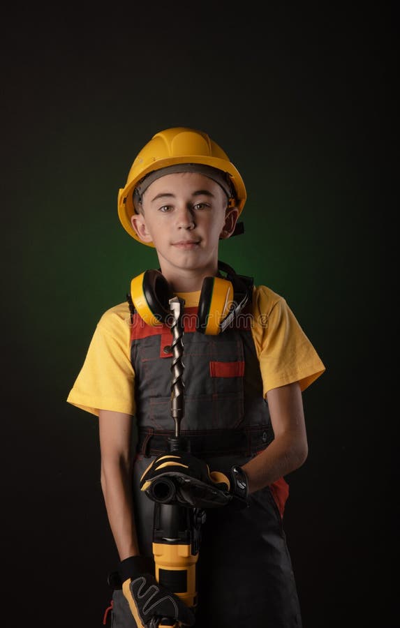 Child the Builder Costume Posing with a Work Tool Stock Image - Image ...