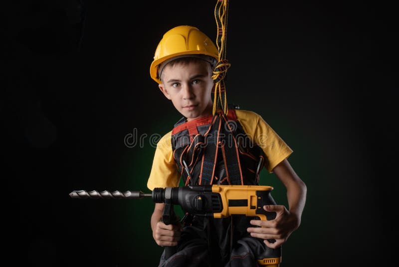 Child the Builder Costume Posing with a Work Tool Stock Photo - Image ...