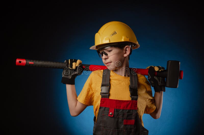 The Child the Builder Costume Posing with a Work Tool Stock Photo ...