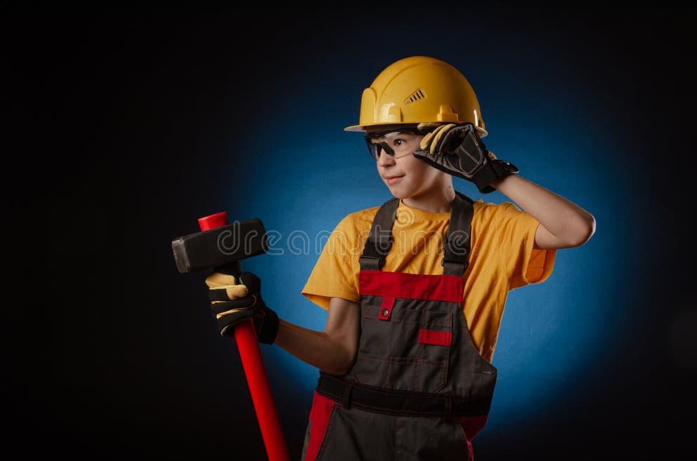 The Child the Builder Costume Posing with a Work Tool Stock Image ...