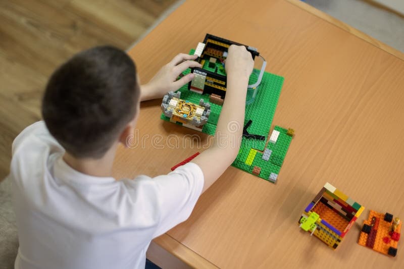 Child Building Structure on Wooden Table, Developing Creativity and ...