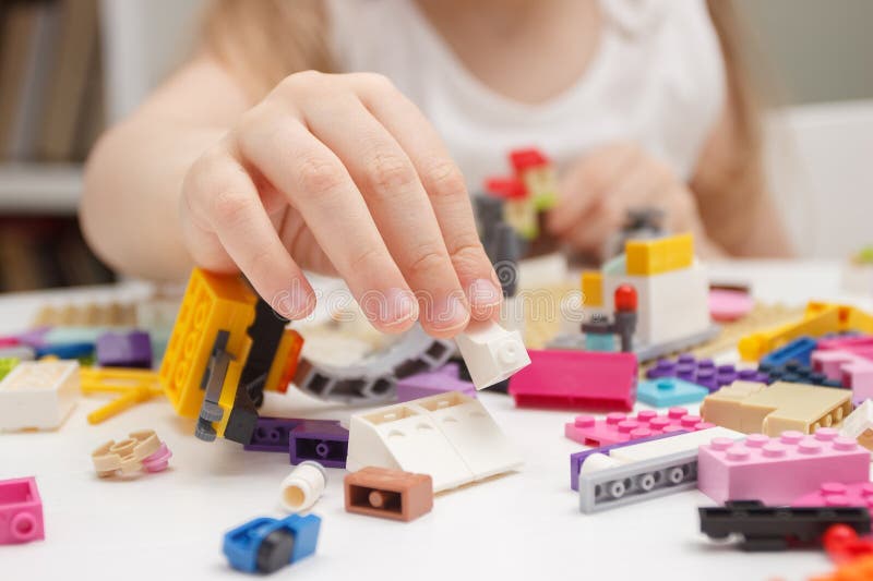Child Builds with Constructor Bricks, Plays with Toys, Blurred ...