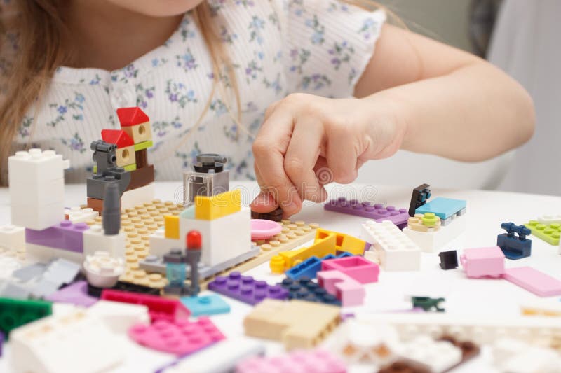 Child Builds with Constructor Bricks, Plays with Toys Stock Photo ...