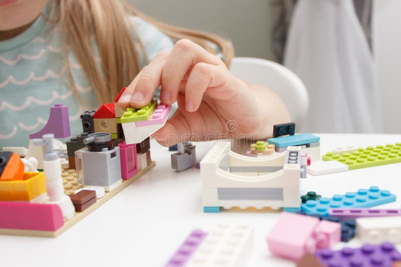 Child Builds with Constructor Bricks, Plays with Toys Stock Photo ...