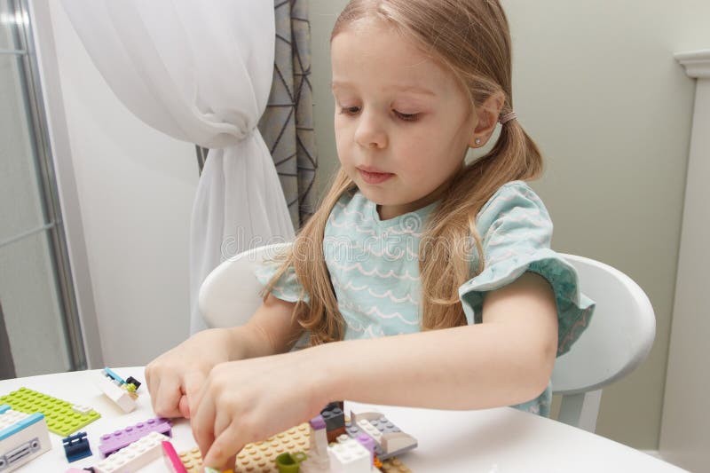 Child Builds with Constructor Bricks, Plays with Toys Stock Image ...