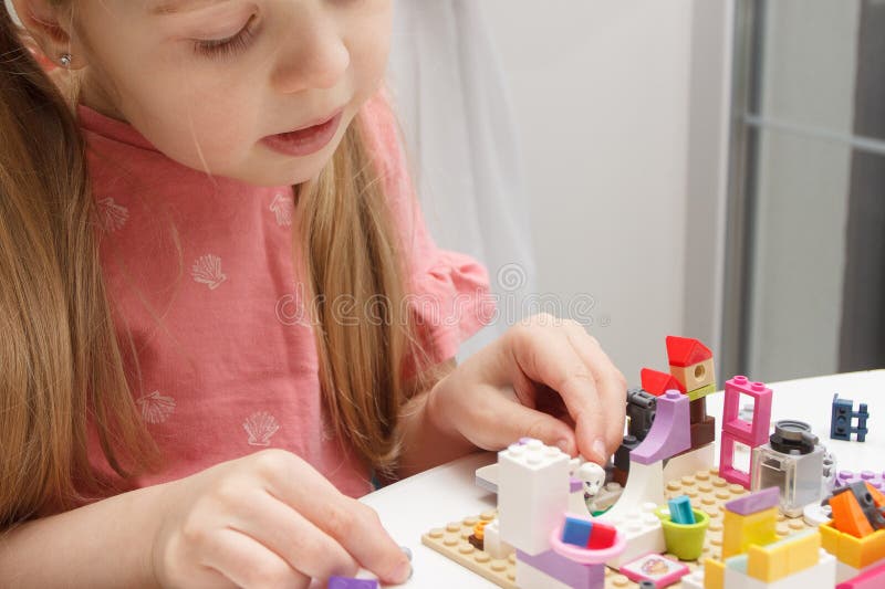 Child Builds with Constructor Bricks, Plays with Toys Stock Photo ...