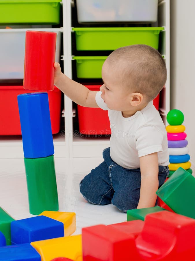 Child Builds a Tower of Cubes Stock Image - Image of activity, puzzle ...