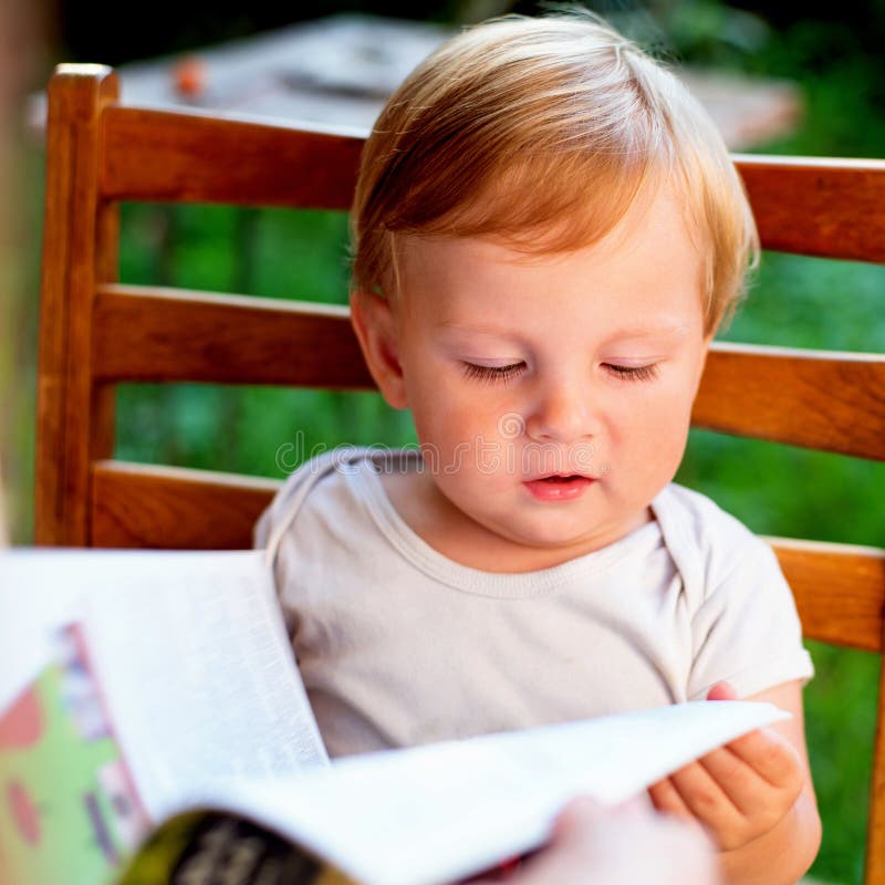 Child carefully reading stock image. Image of education - 32824057