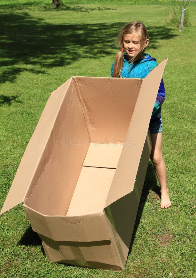 Child carrying a box stock image. Image of pull, meadow - 40963209