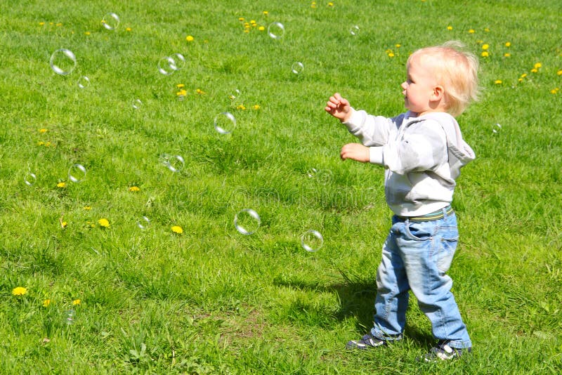 Child playing with bubbles stock image. Image of childhood - 16677913