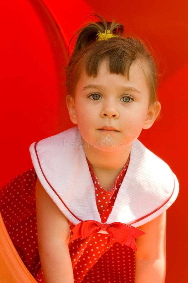 Child Caught Crawling Up a Slide Stock Photo - Image of children ...