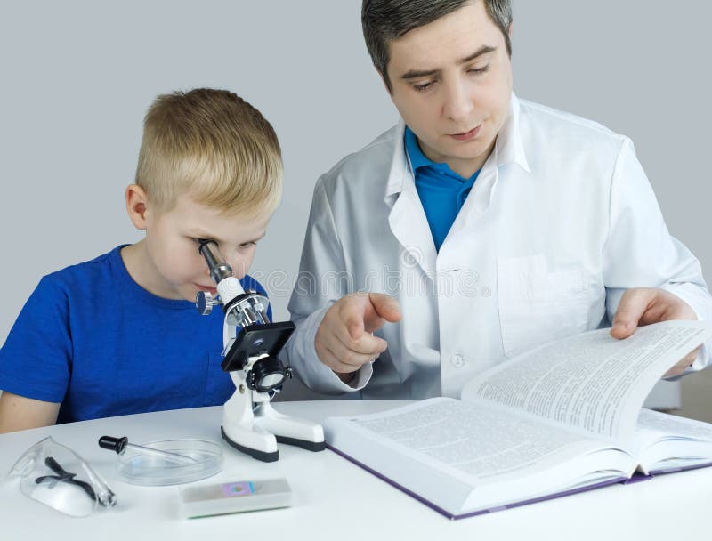 Child Chemist. Teacher Shows a Visual Experiment. a Science Mentor ...