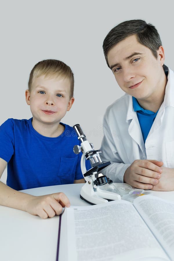 Child Chemist. Teacher Shows a Visual Experiment. a Science Mentor ...