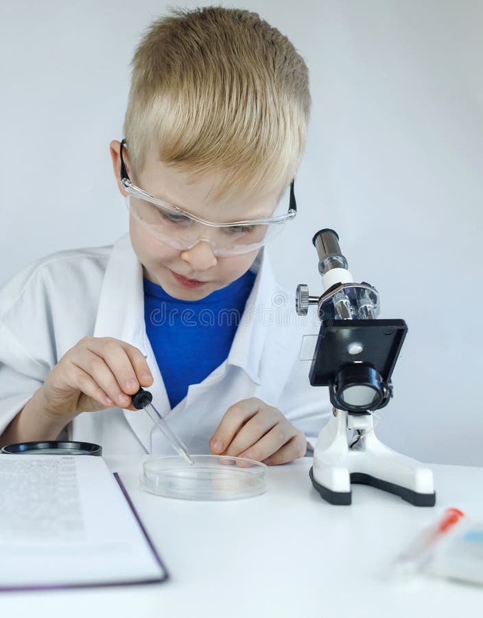 Child Chemist. Teacher Shows a Visual Experiment. a Science Mentor ...