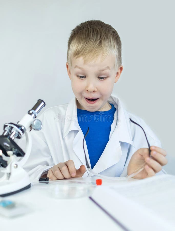 Child Chemist. Teacher Shows a Visual Experiment. a Science Mentor ...