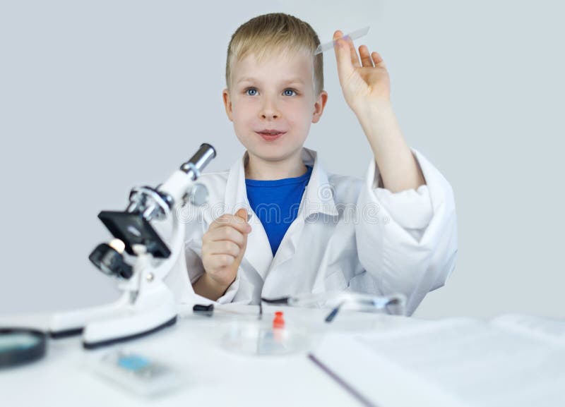 Child Chemist. Teacher Shows a Visual Experiment. a Science Mentor Teaches an Experimental ...