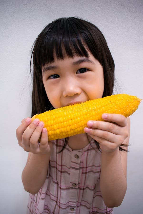 Child Eating a Corn Cob stock photo. Image of chews - 101778140