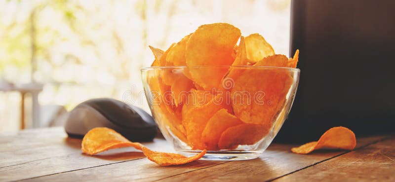 Child with Chips Behind a Computer. Selective Focus Stock Image - Image ...