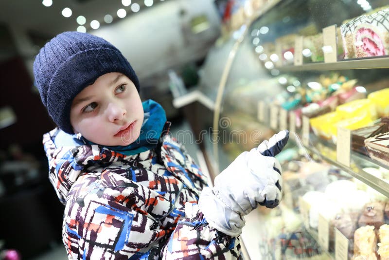 Child Choosing Cake in Restaurant Showcase Stock Image - Image of child ...