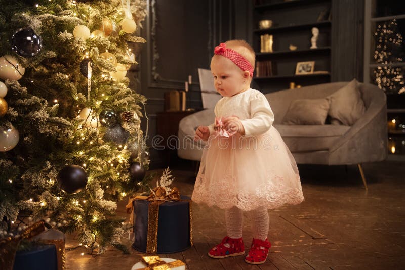 Child and Christmas Tree. stock image. Image of domestic - 170999595
