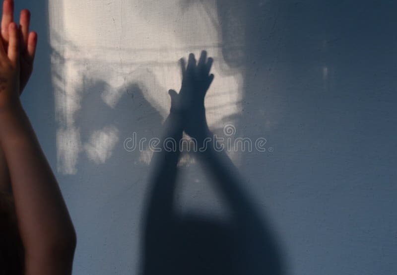Defocus Shadows of Kid Clapping Hands on Stucco Wall Surface with Copy ...