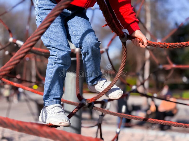 Child Climbing on Playground Rope Structure in Park Stock Image - Image ...