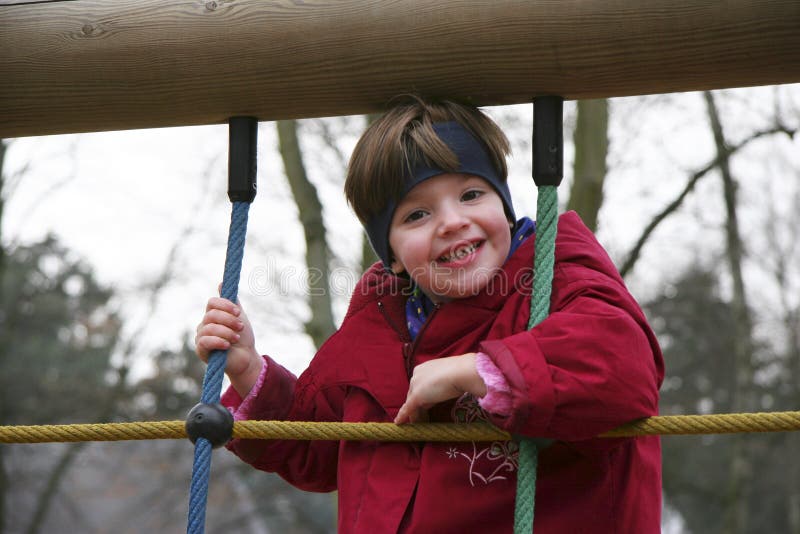 Child in climbing rope 01 stock image. Image of full, laugh - 731563