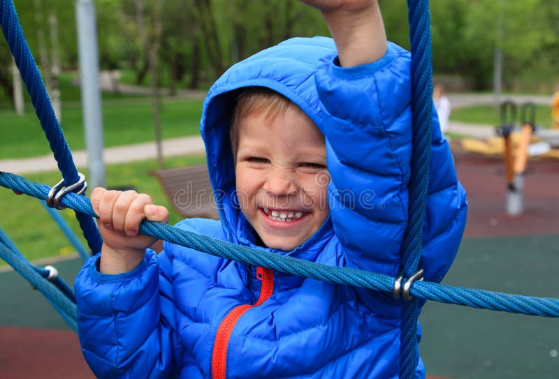 Child Climbing Rope On The Playground Stock Photo - Image of kids ...