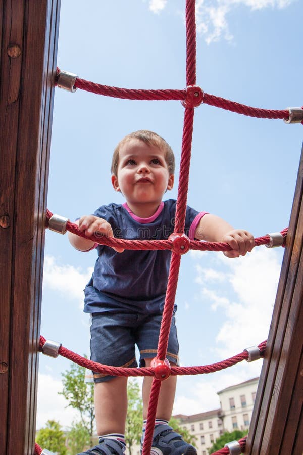Child Climbing Ropes in a Playground Stock Photo - Image of leisure ...