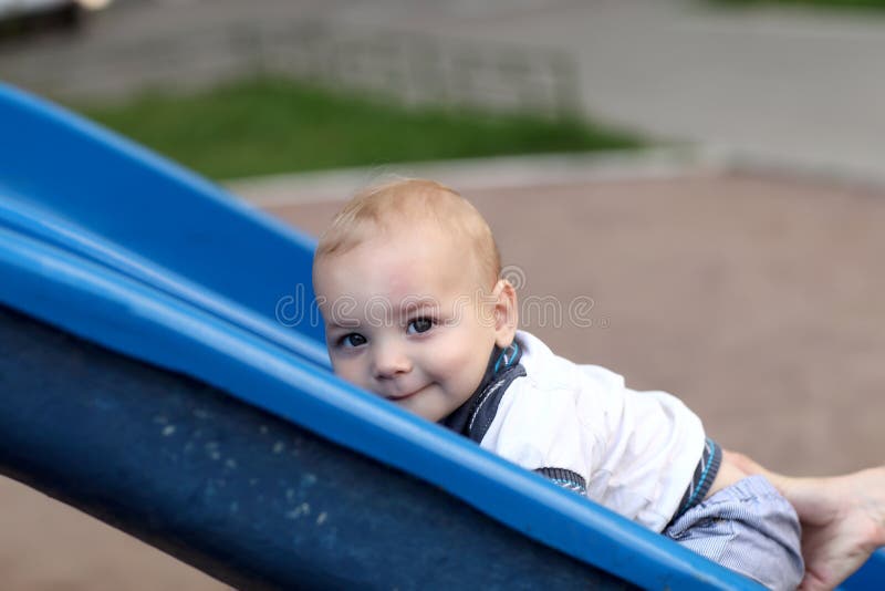 Kid sliding on a slide stock image. Image of park, person - 32261501