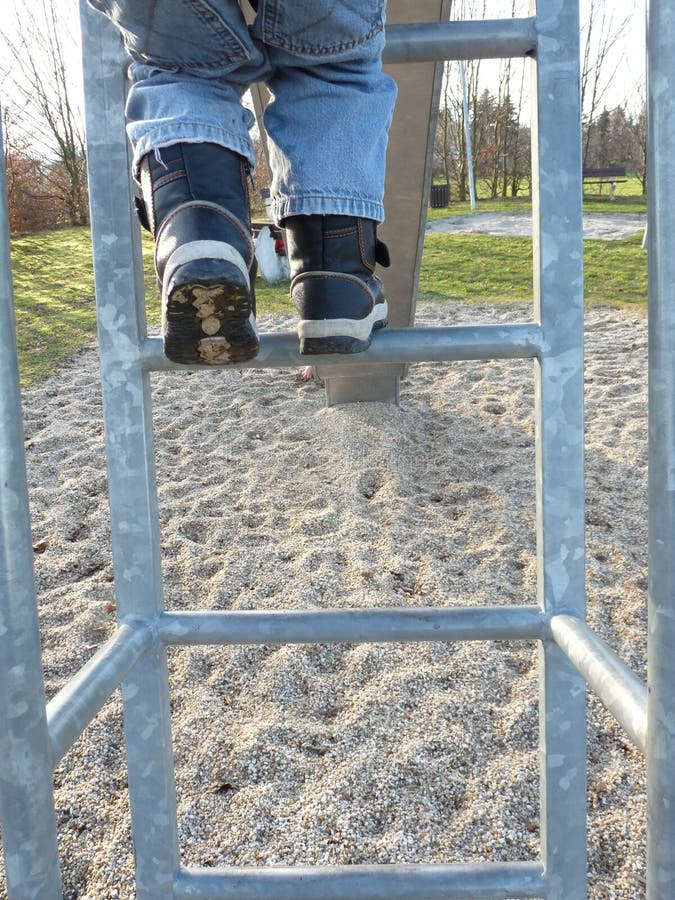 A Child Climbs Up a Ladder of a Slide Stock Image - Image of climb ...