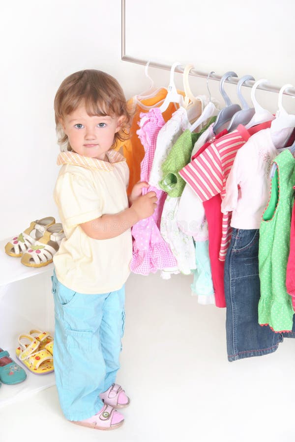 Child in the clothes shop stock photo. Image of baby - 11062762
