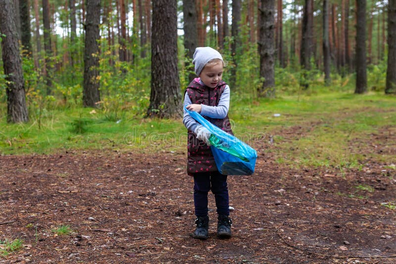 Child Clear the Forest of Garbage. Instilling Respect for Nature Stock ...