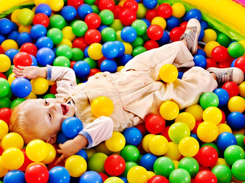 Child in colored ball. stock photo. Image of birthday - 26671588