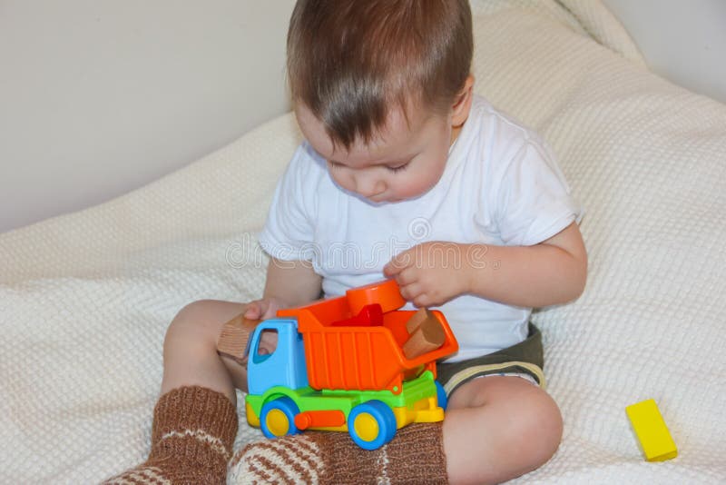 A Child and a Colorful Typewriter. a Toy for the Little Ones Stock ...