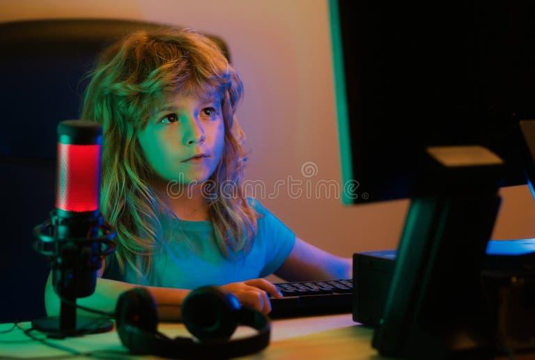 Child with Computer Late at Night. Neon Blue Light. Little Hacker ...