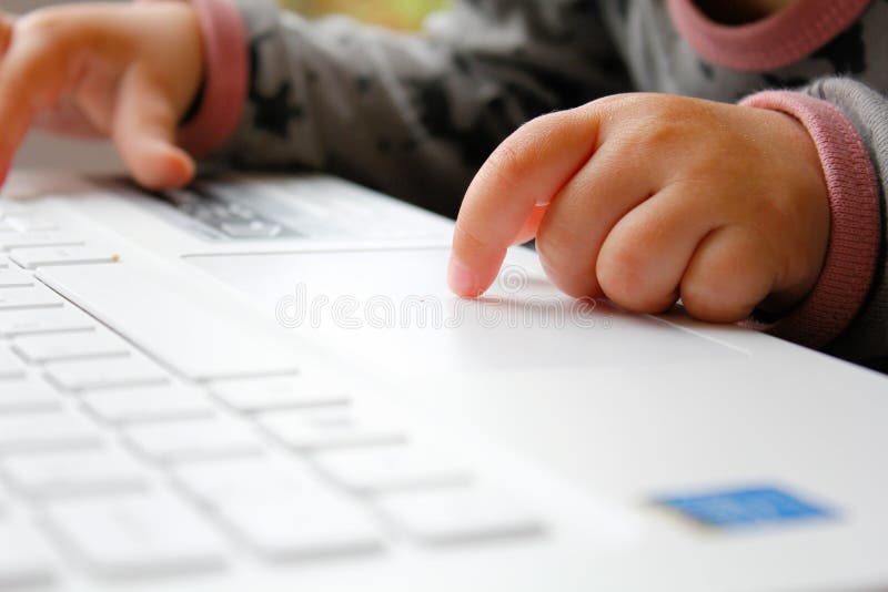 Child with a computer stock photo. Image of close, online - 53374486