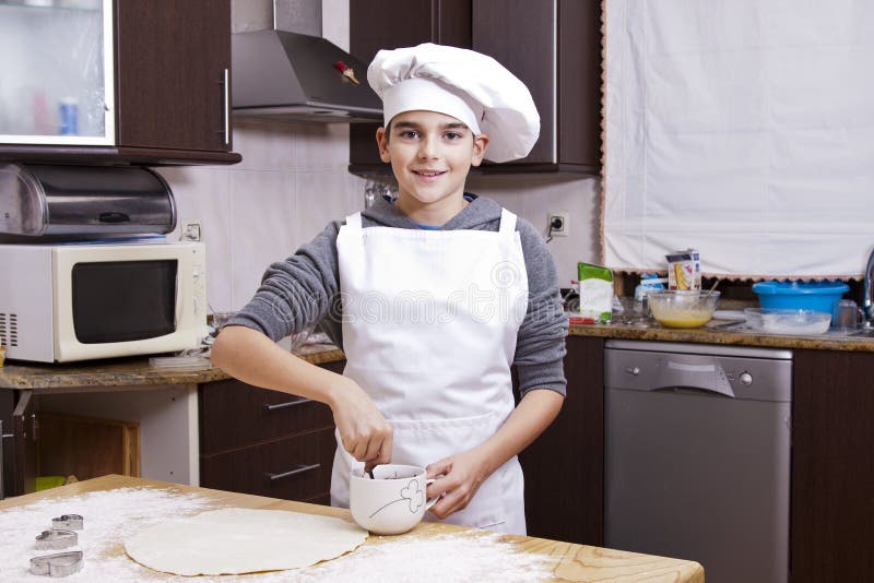 Child cooking stock image. Image of cooking, cook, costume - 66529055