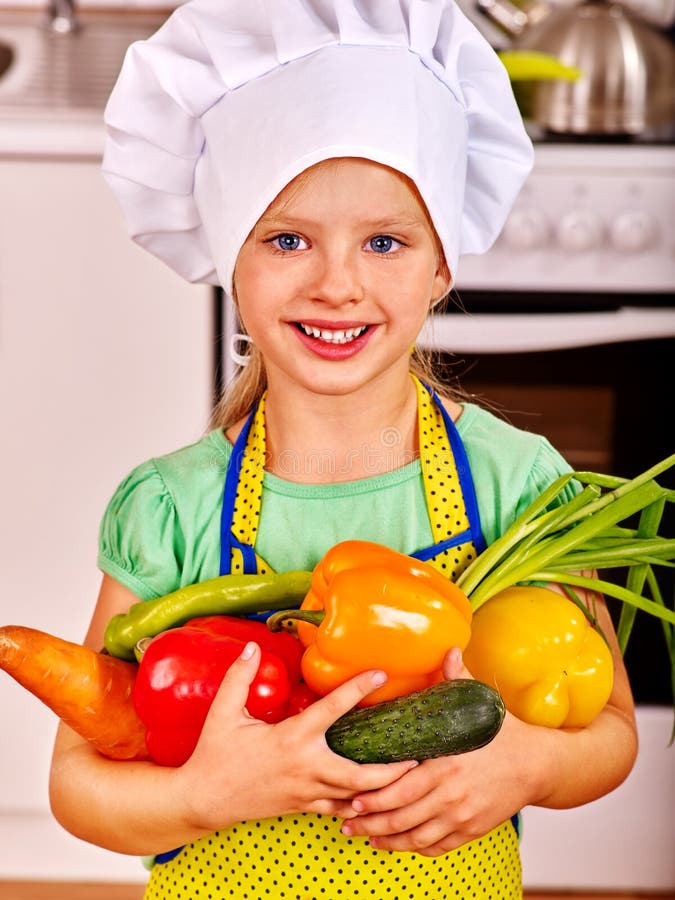 Child cooking at kitchen stock photo. Image of apron - 52687904