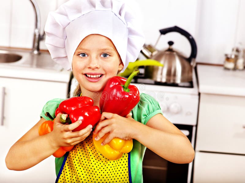 Child cooking at kitchen. stock image. Image of capsicum - 34070845